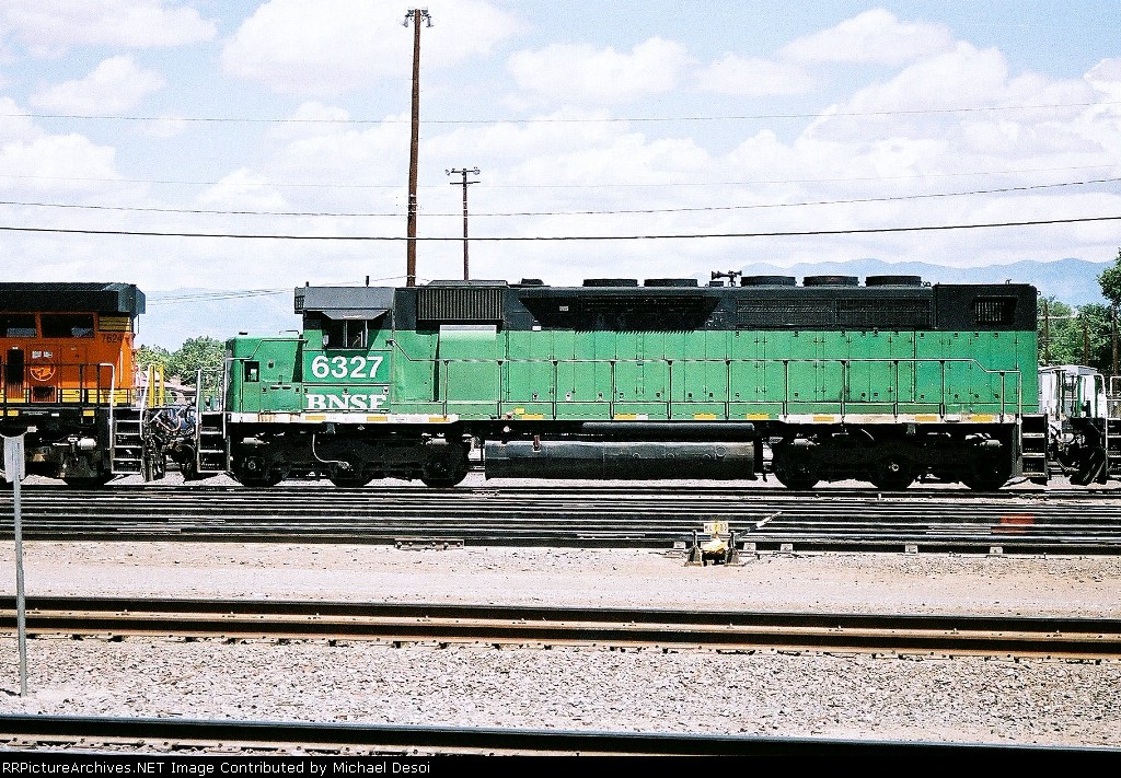 BNSF Rarebird SPD-40 #6327 is mid consist in the yard